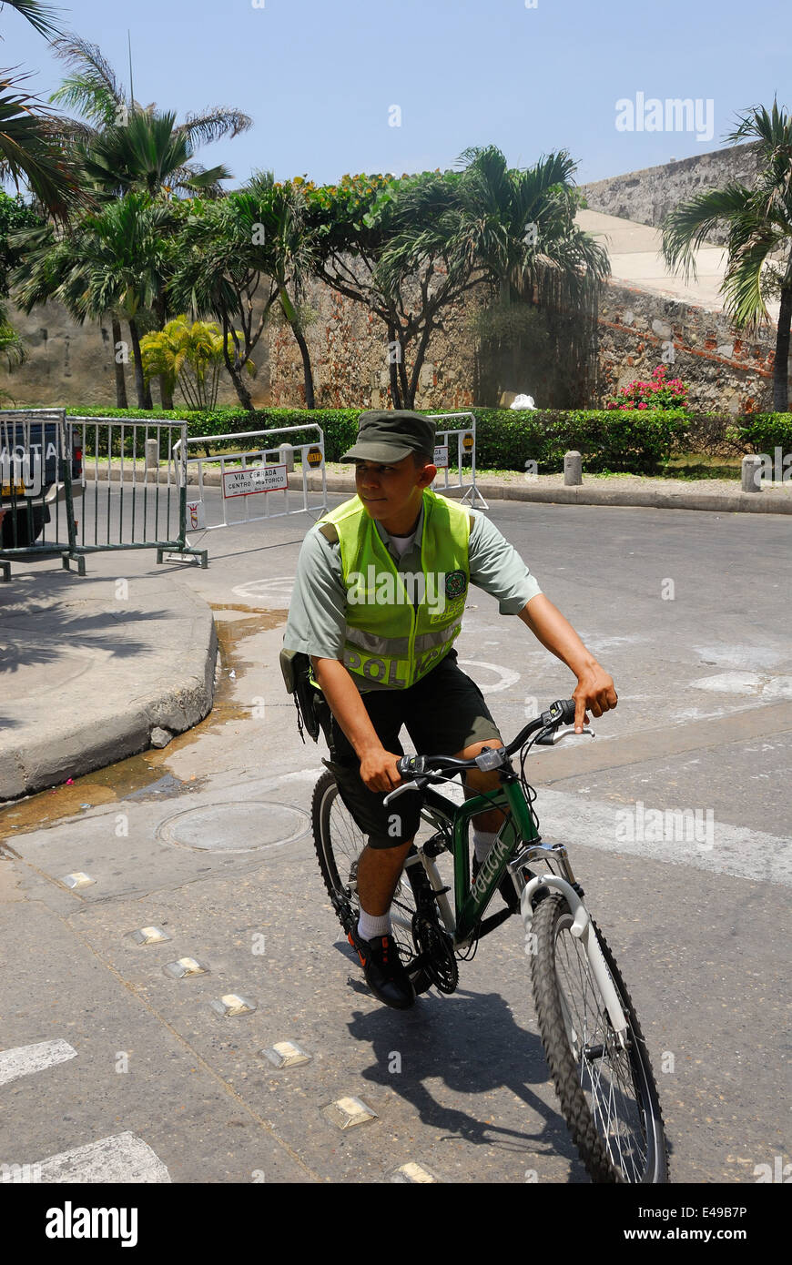 Local policeman (policia) riding a bicycle Stock Photo - Alamy
