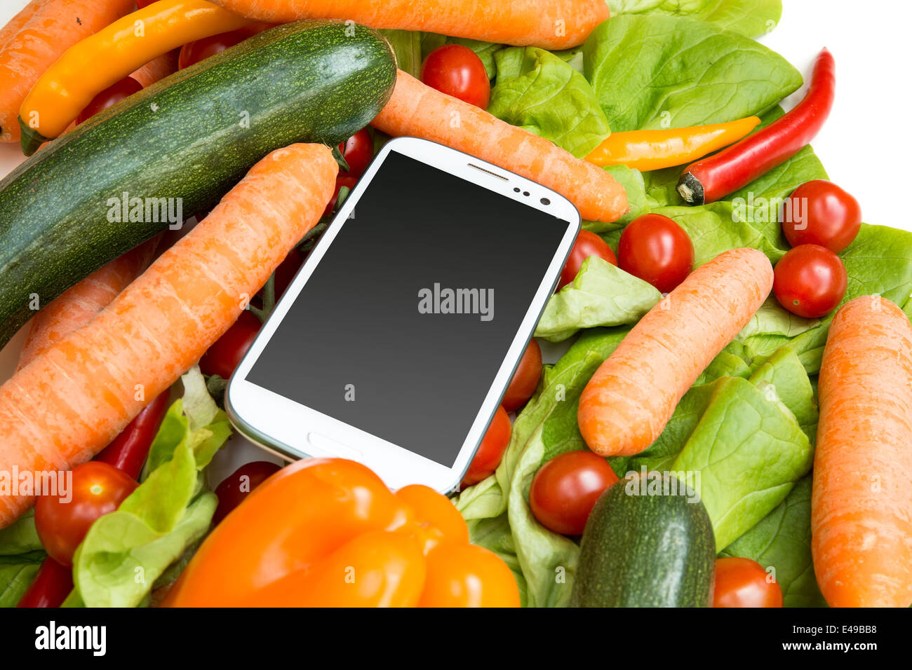 Various vegetables with a Smartphone Stock Photo - Alamy