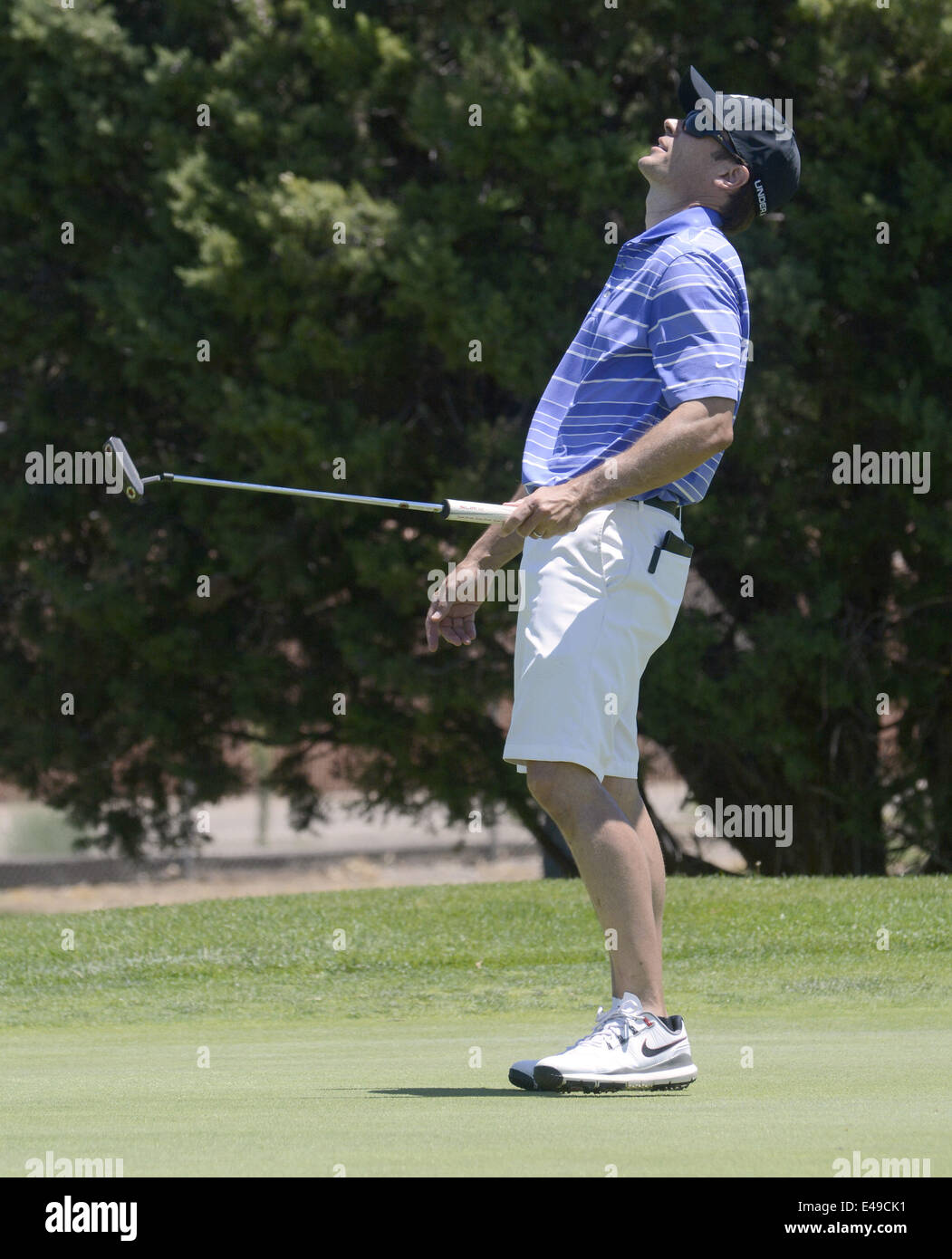 Usa. 6th July, 2014. SPORTS -- Tim With reacts to his putt during the ...