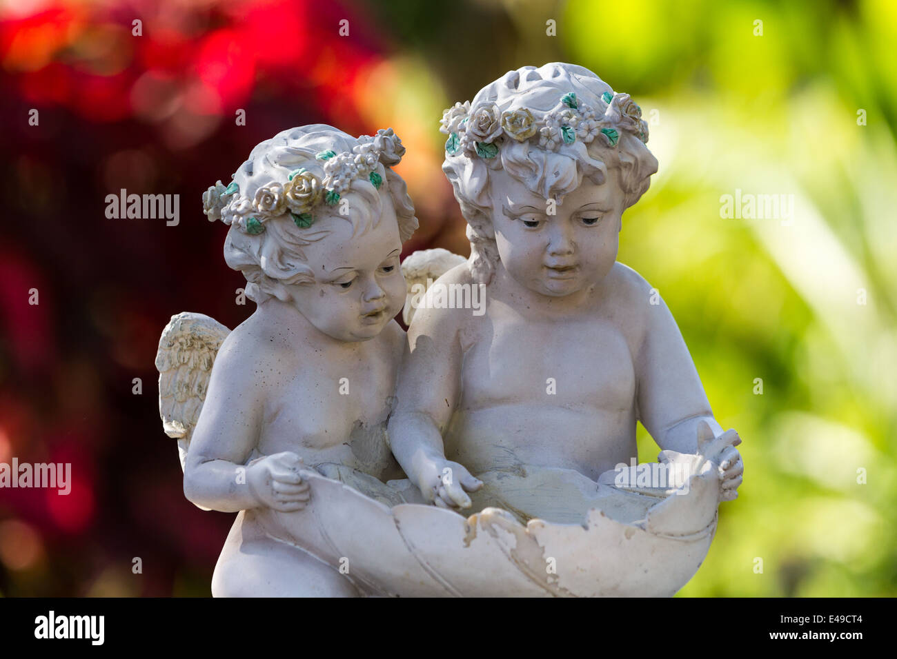 statue of two young angels with wings sharing a beautiful moment Stock ...