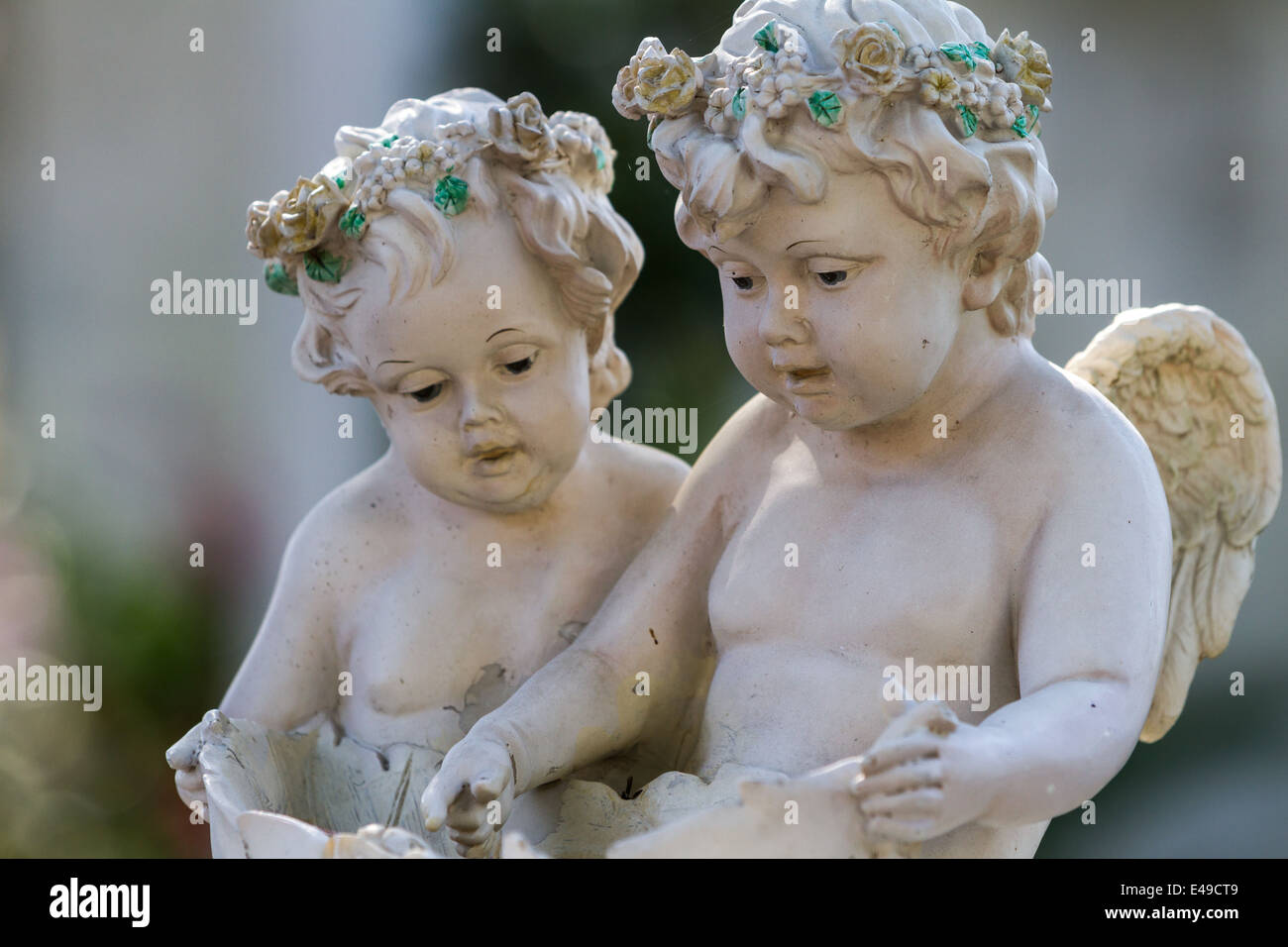 statue of two young angels with wings sharing a beautiful moment Stock ...