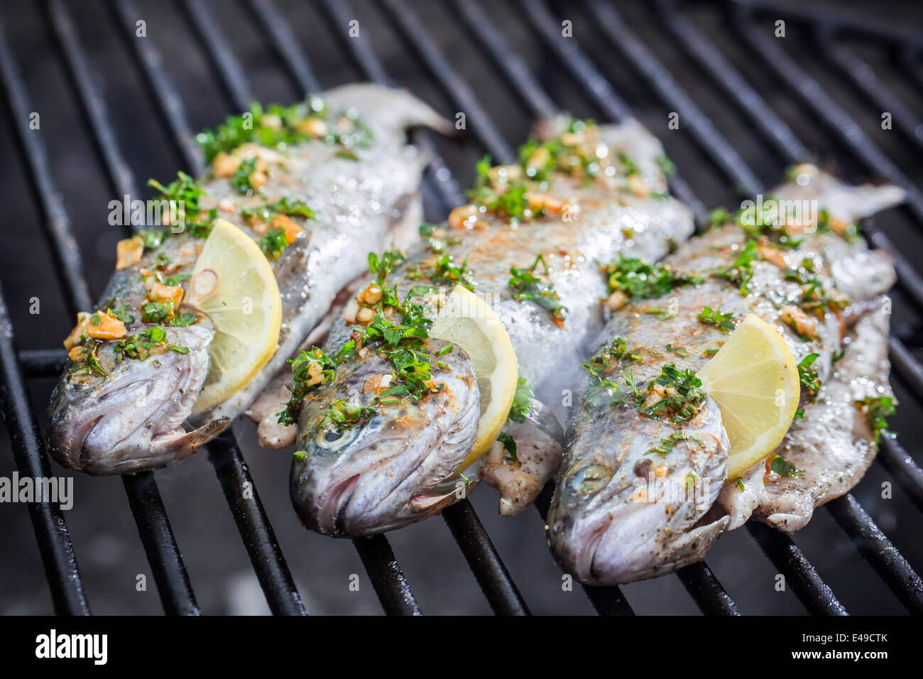 Grilled fish with lemon and spices Stock Photo - Alamy