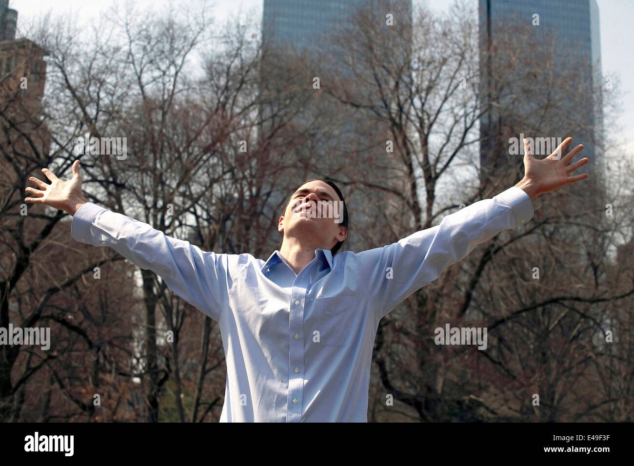 Man outdoors in praise with arms extended Stock Photo - Alamy