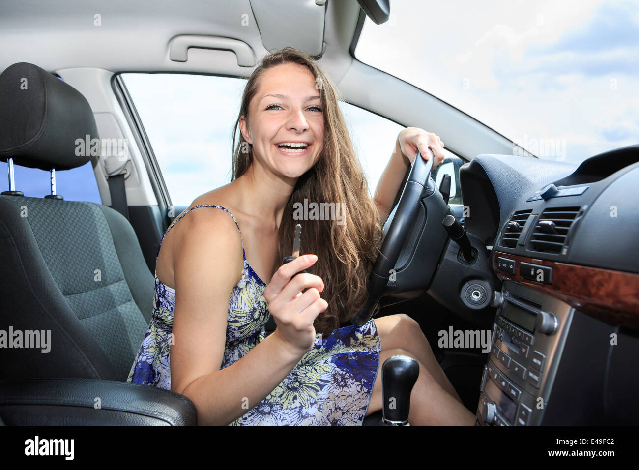 young girl driving a new car Stock Photo - Alamy