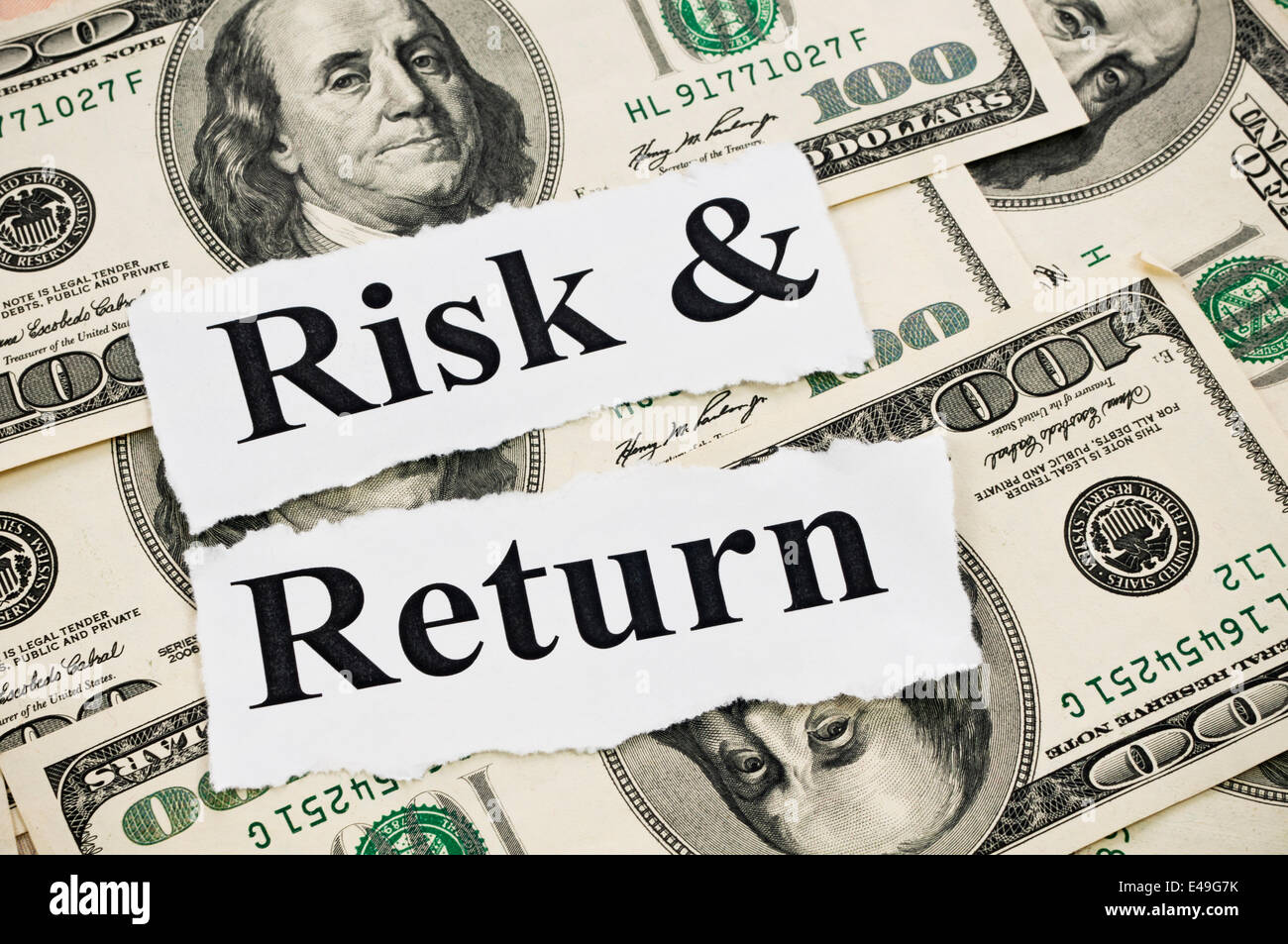 Risk and return words on hundreds US notes Stock Photo - Alamy