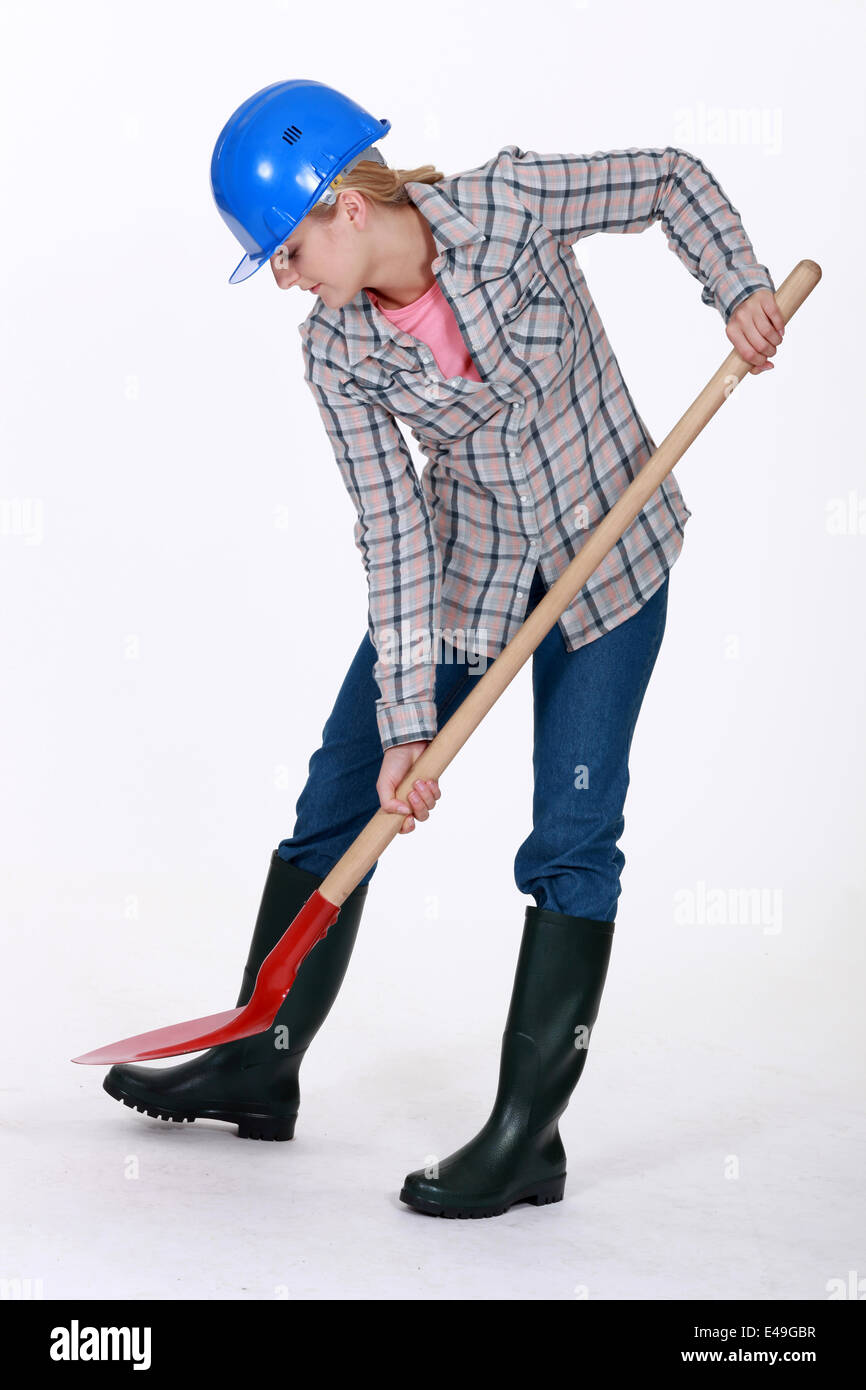 Woman digging a hole hi-res stock photography and images - Alamy