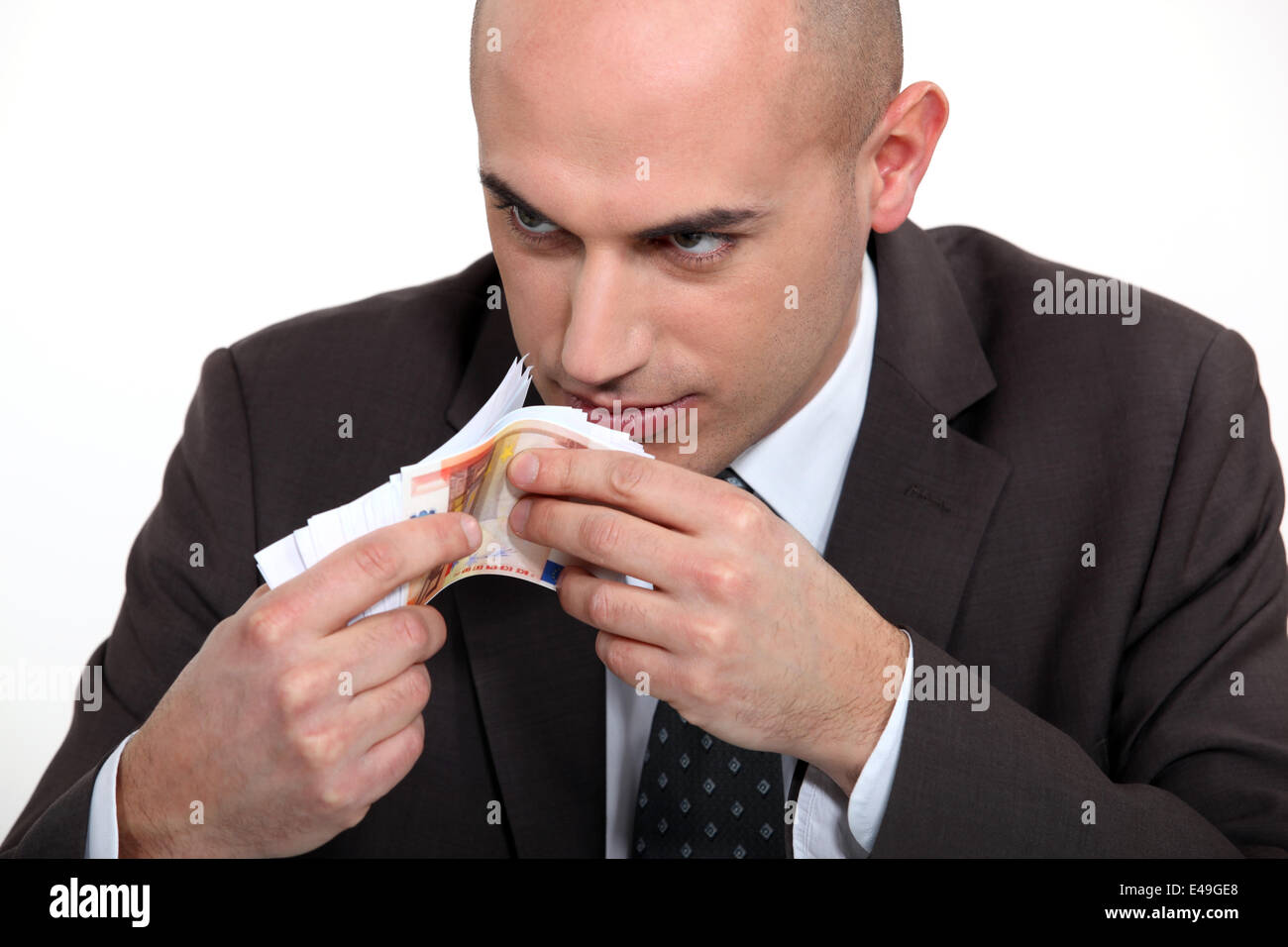 bad man smelling money Stock Photo - Alamy