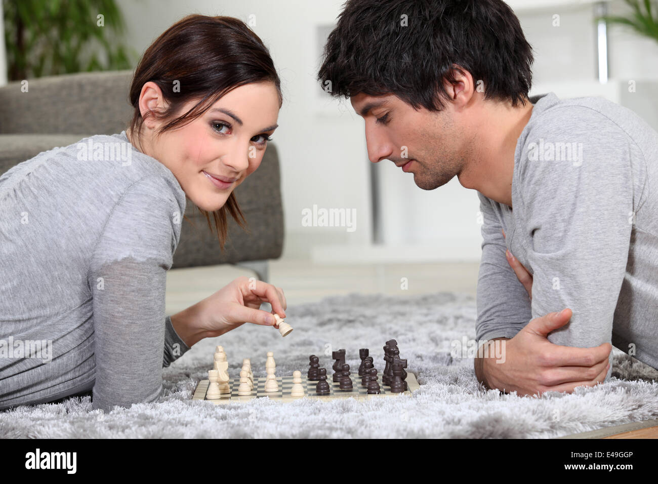 couple playing chess Stock Photo - Alamy