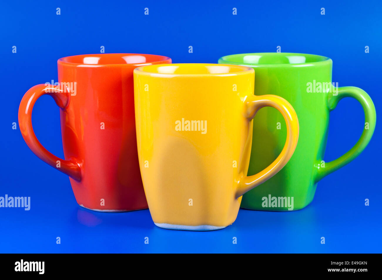 Three colorful cups Stock Photo - Alamy