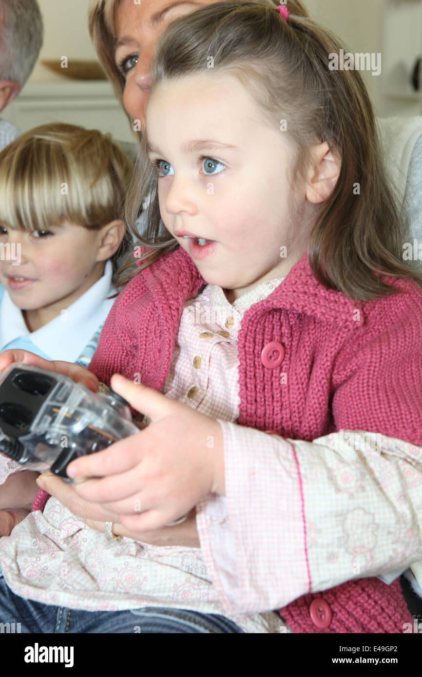Girl playing console Stock Photo - Alamy