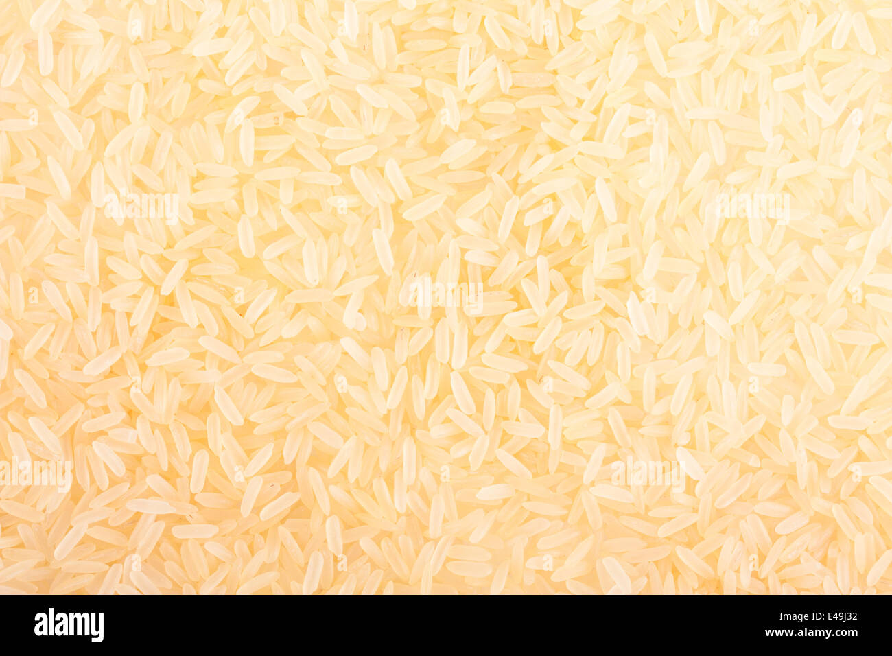 Yellow rice background Stock Photo - Alamy