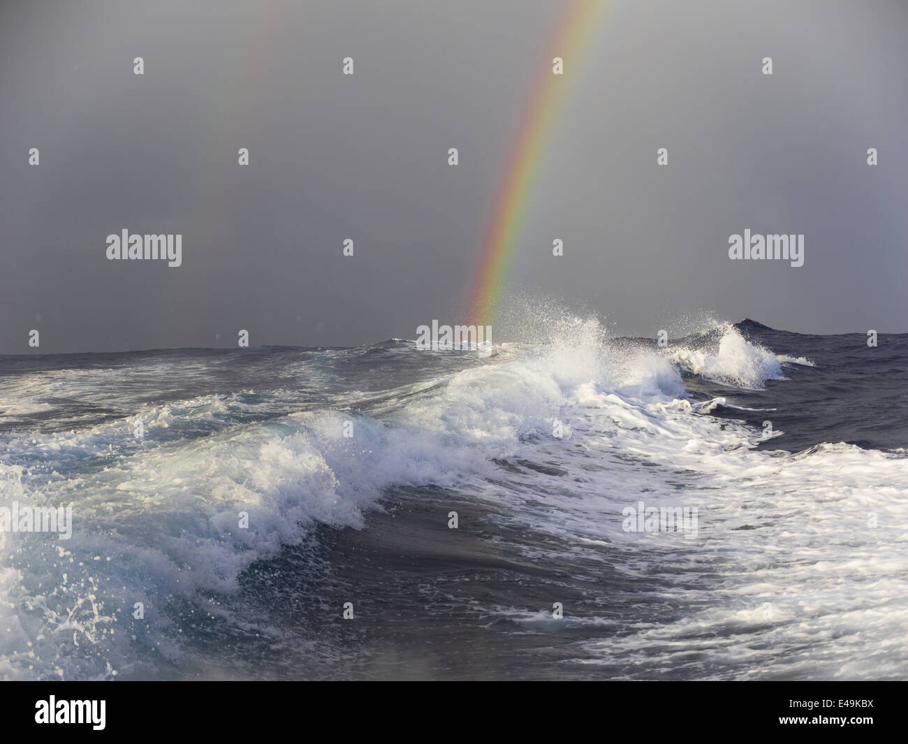 Caribbean, Martinique, Waves and rainbw above the ocean Stock Photo - Alamy