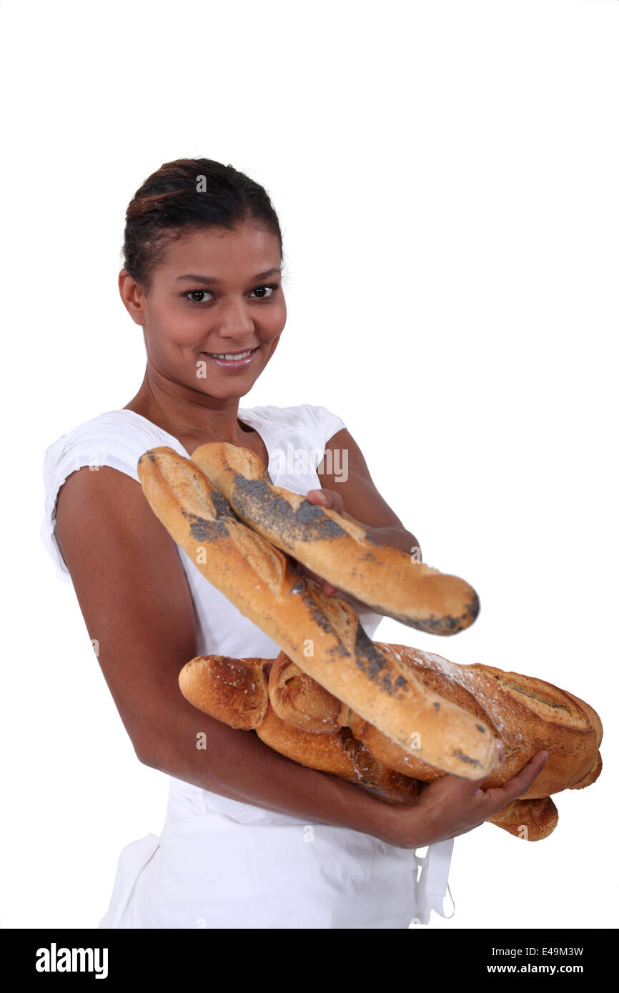 Female baker with loaves of bread Stock Photo - Alamy