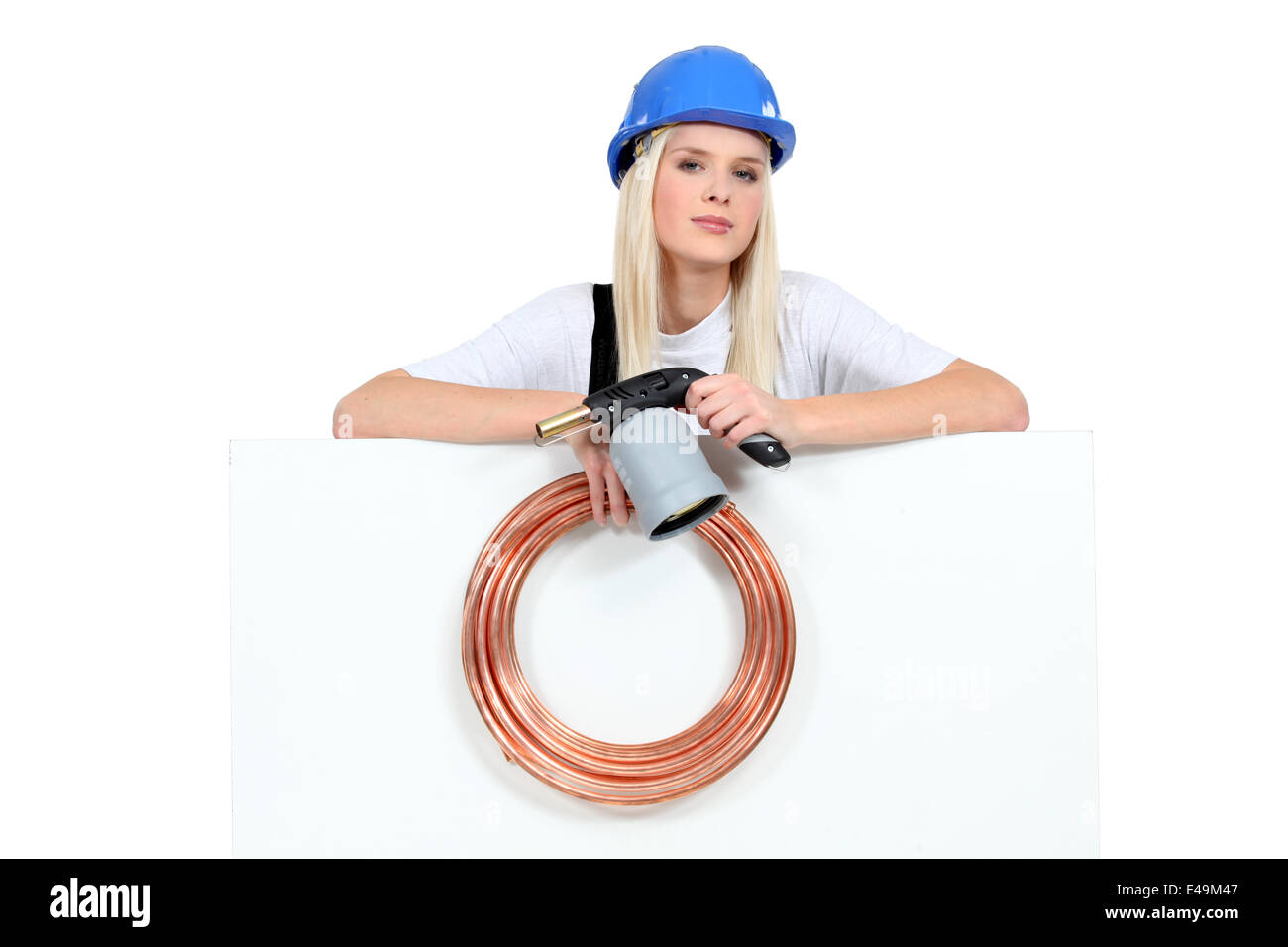 Female plumber with advertising board Stock Photo - Alamy