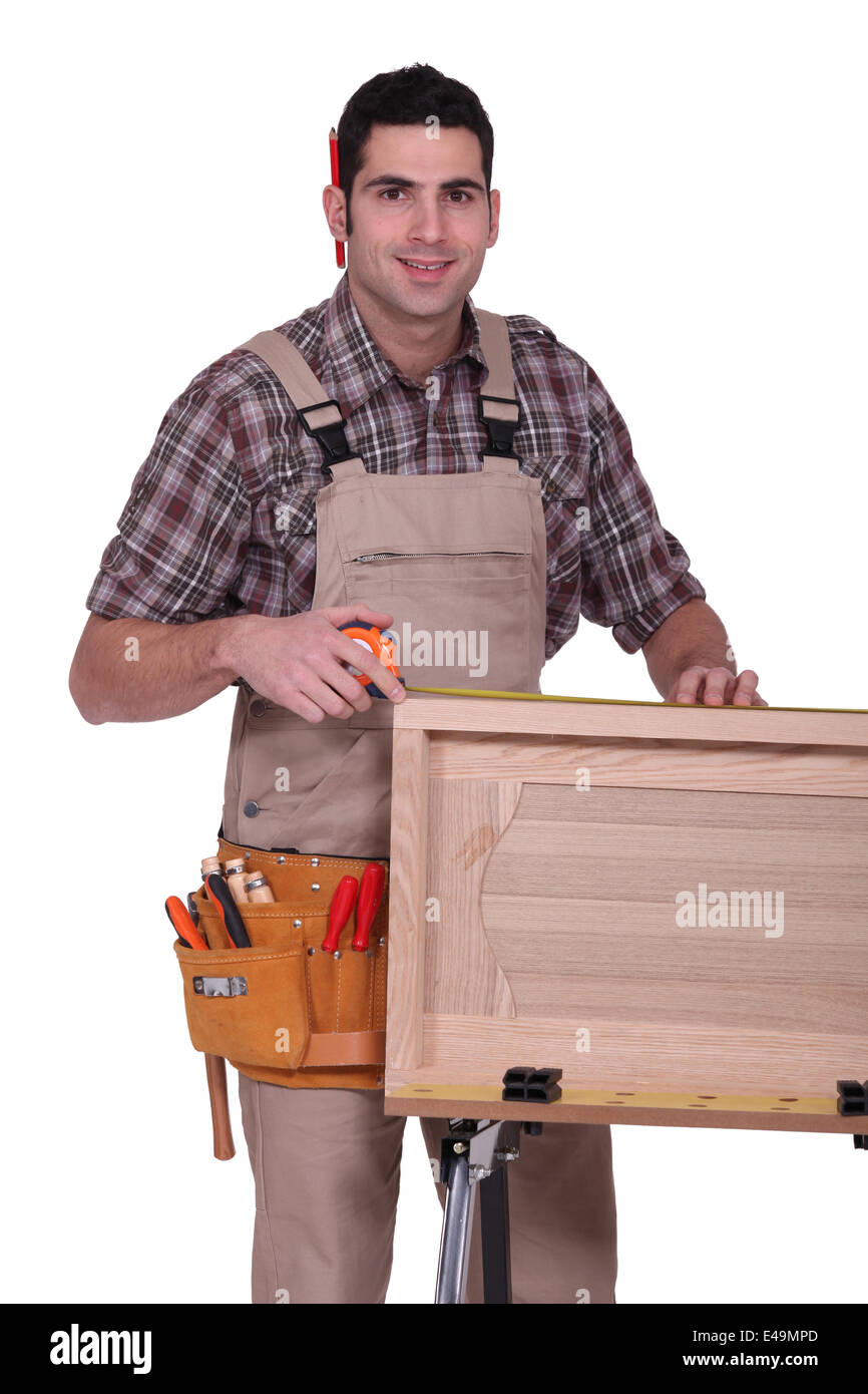 A carpenter working on a closet door Stock Photo - Alamy