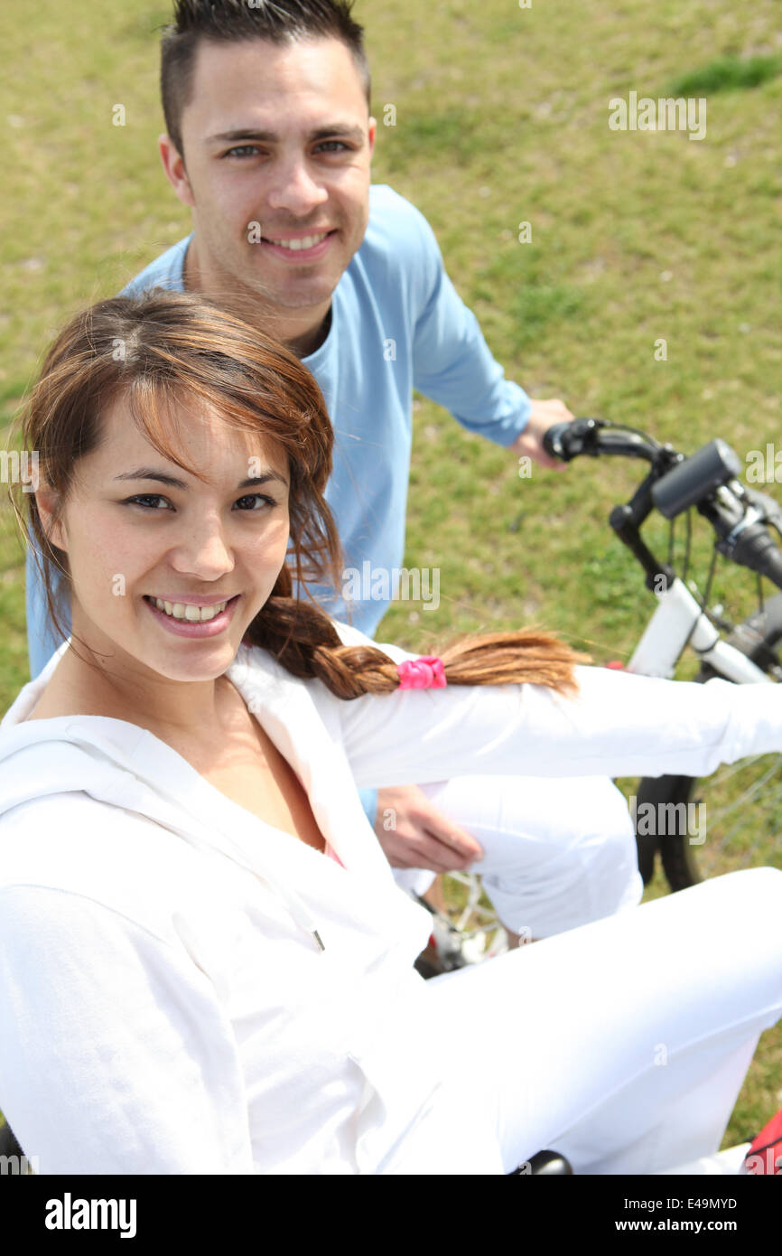 Couple out for a bike ride Stock Photo - Alamy