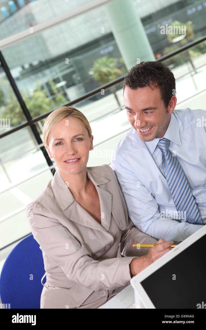 Couple at work Stock Photo - Alamy