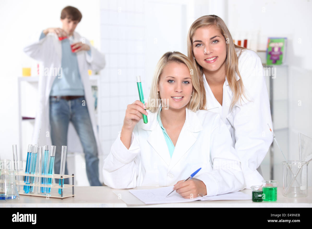 Three people working in a lab Stock Photo - Alamy