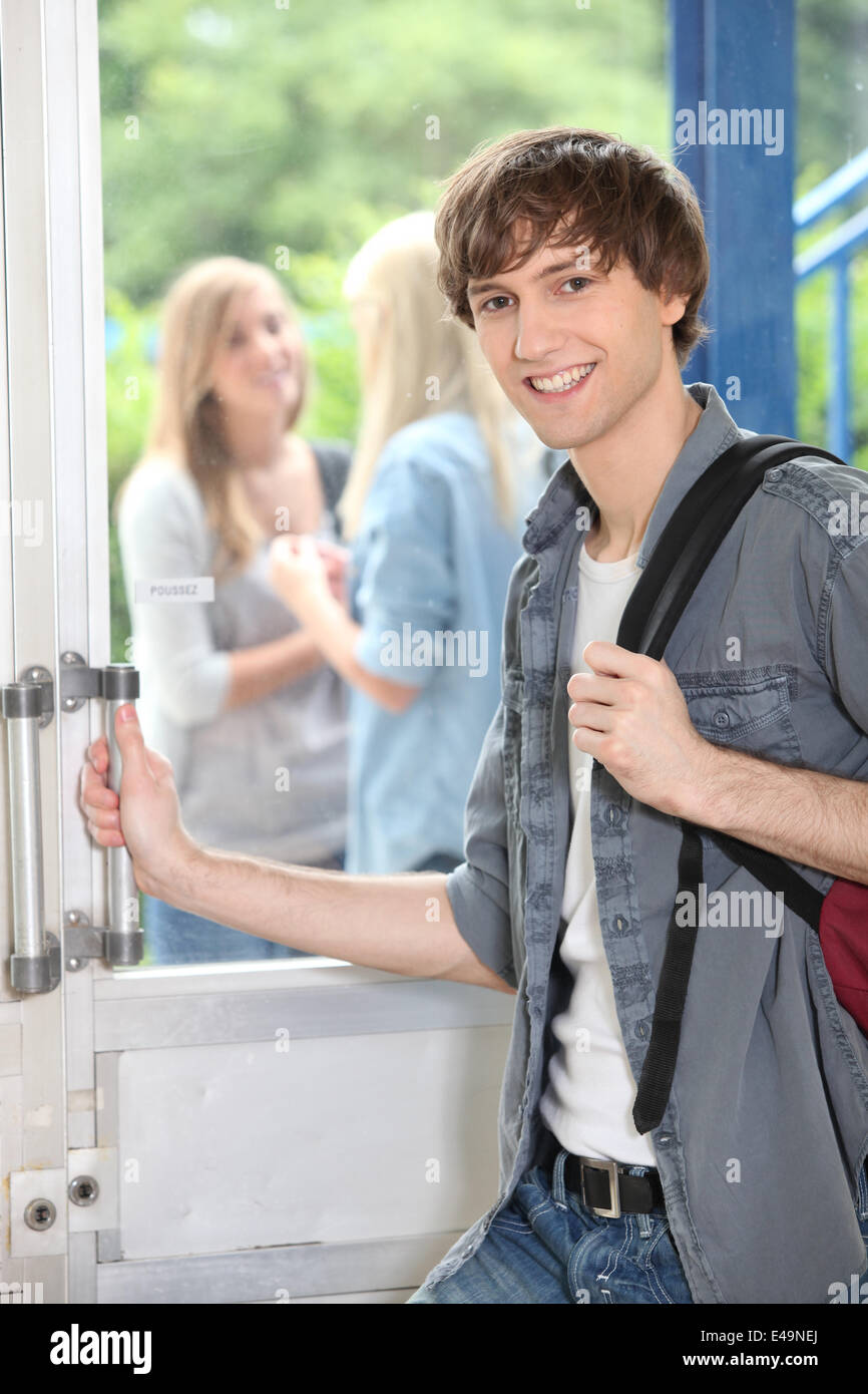 teenage boy leaving high school Stock Photo - Alamy