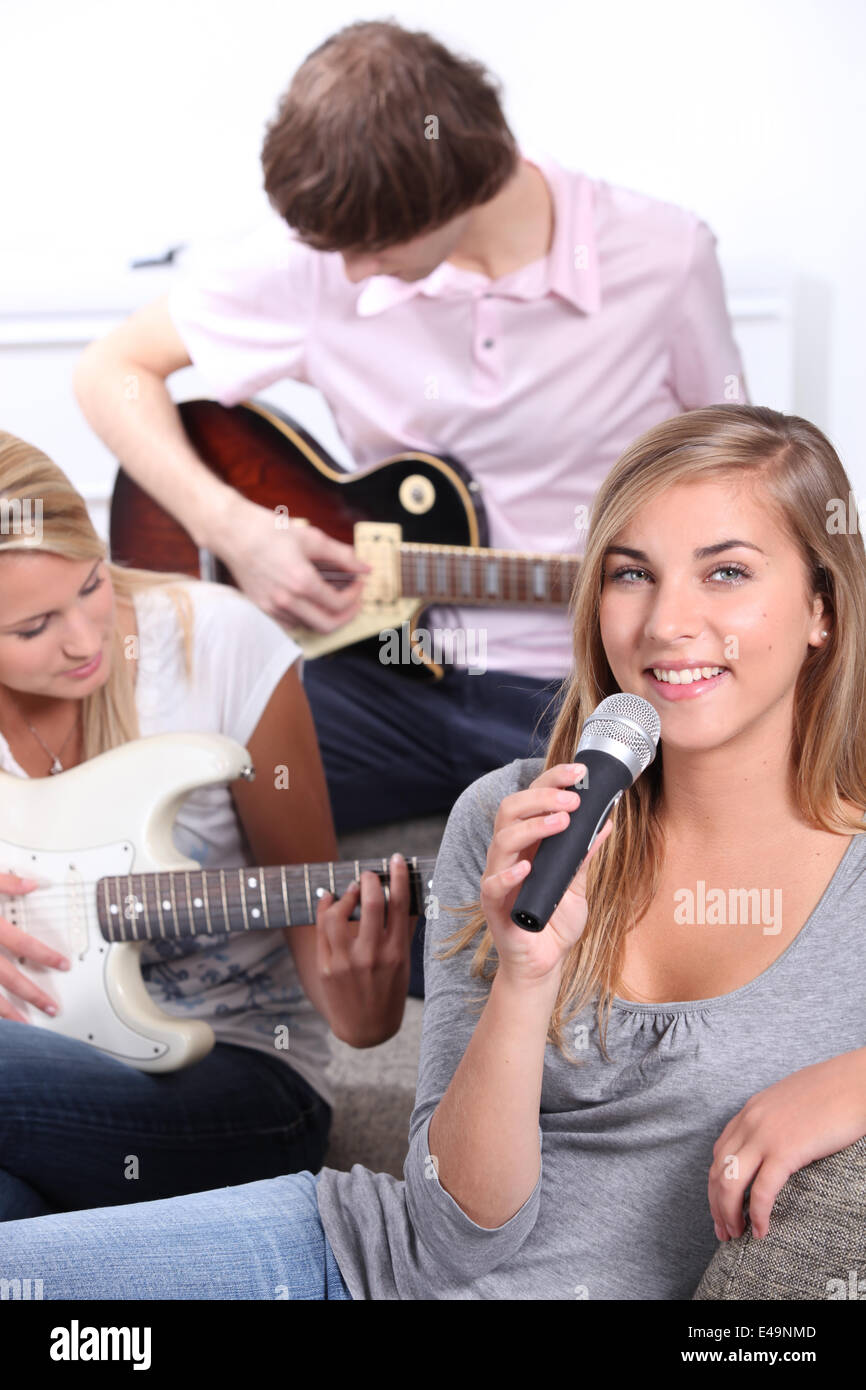 Teenagers playing musical instruments Stock Photo - Alamy