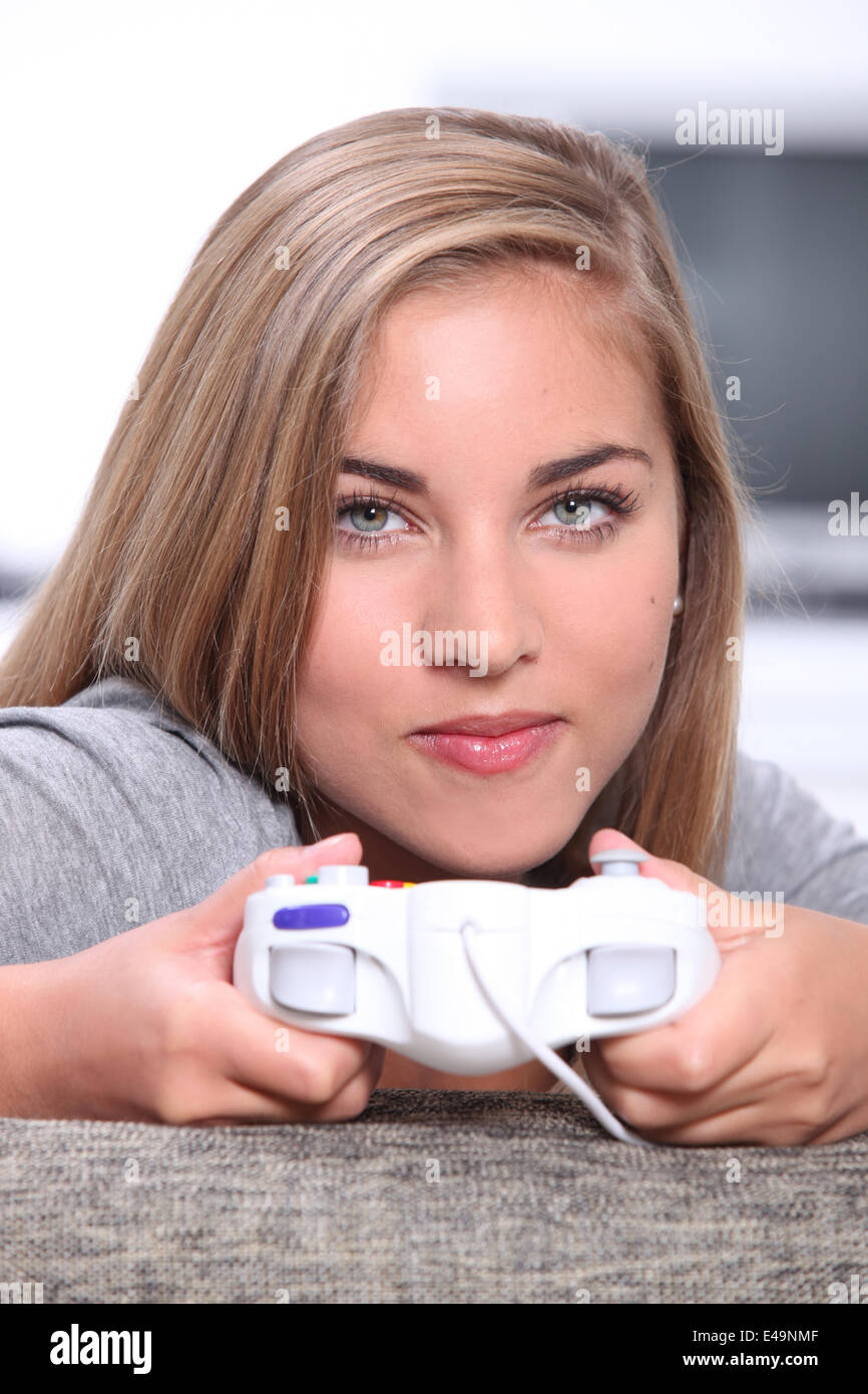 Teenage girl playing on games console Stock Photo - Alamy