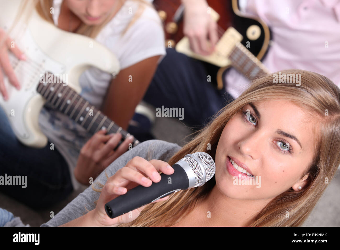 Three teenager playing instruments Stock Photo - Alamy