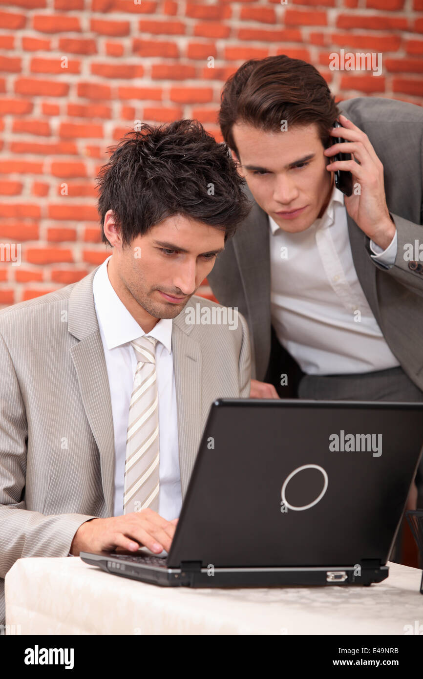Men resolving a problem on computer Stock Photo - Alamy