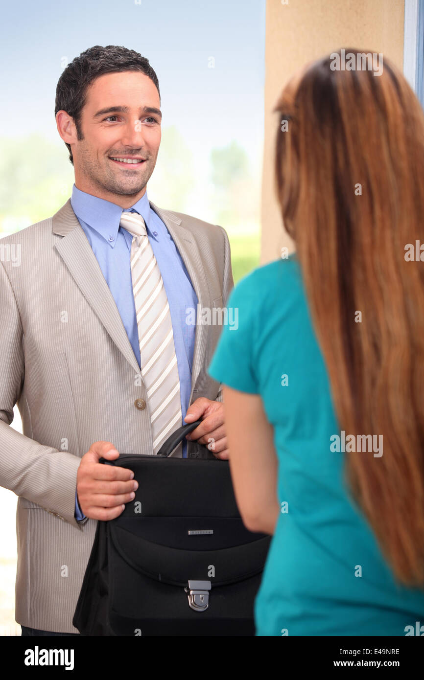 Woman meeting man front door hi-res stock photography and images - Alamy