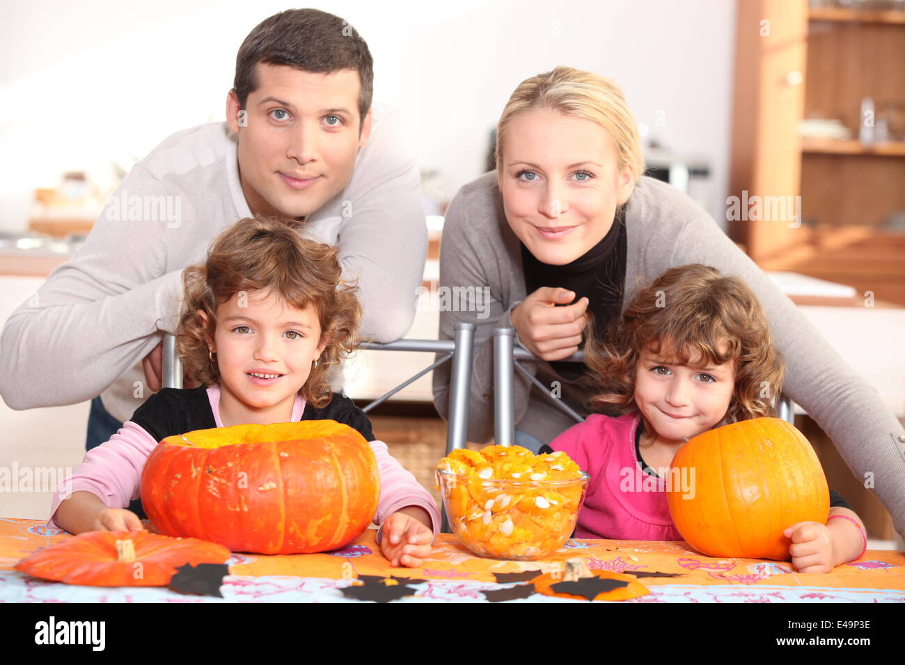A family carving Halloween pumpkins Stock Photo - Alamy