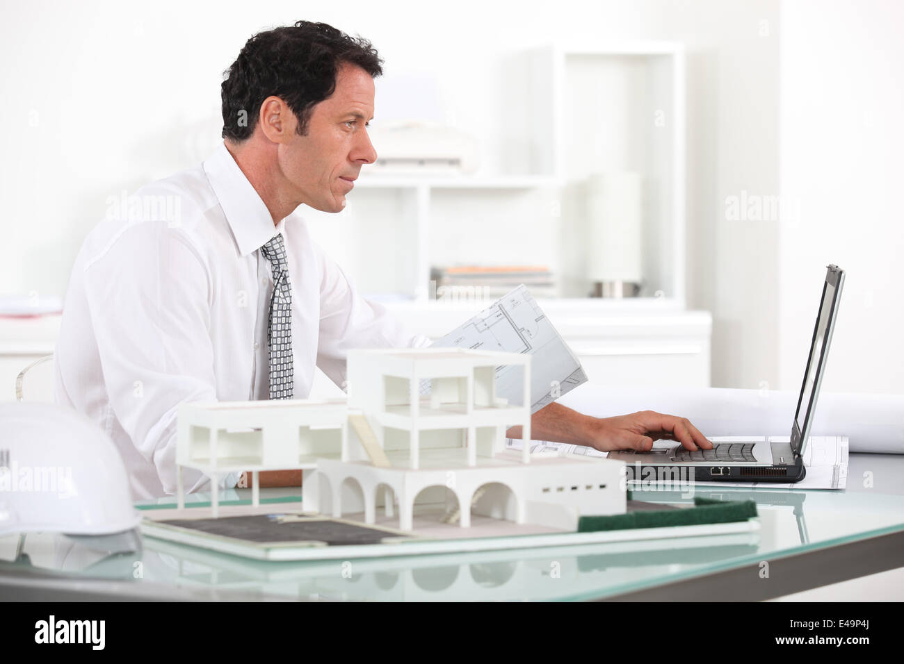 Architect working in his office Stock Photo - Alamy