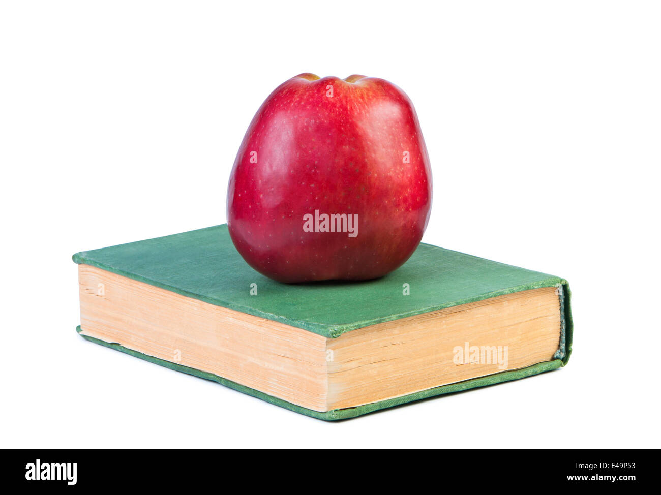 An apple on a book Stock Photo - Alamy