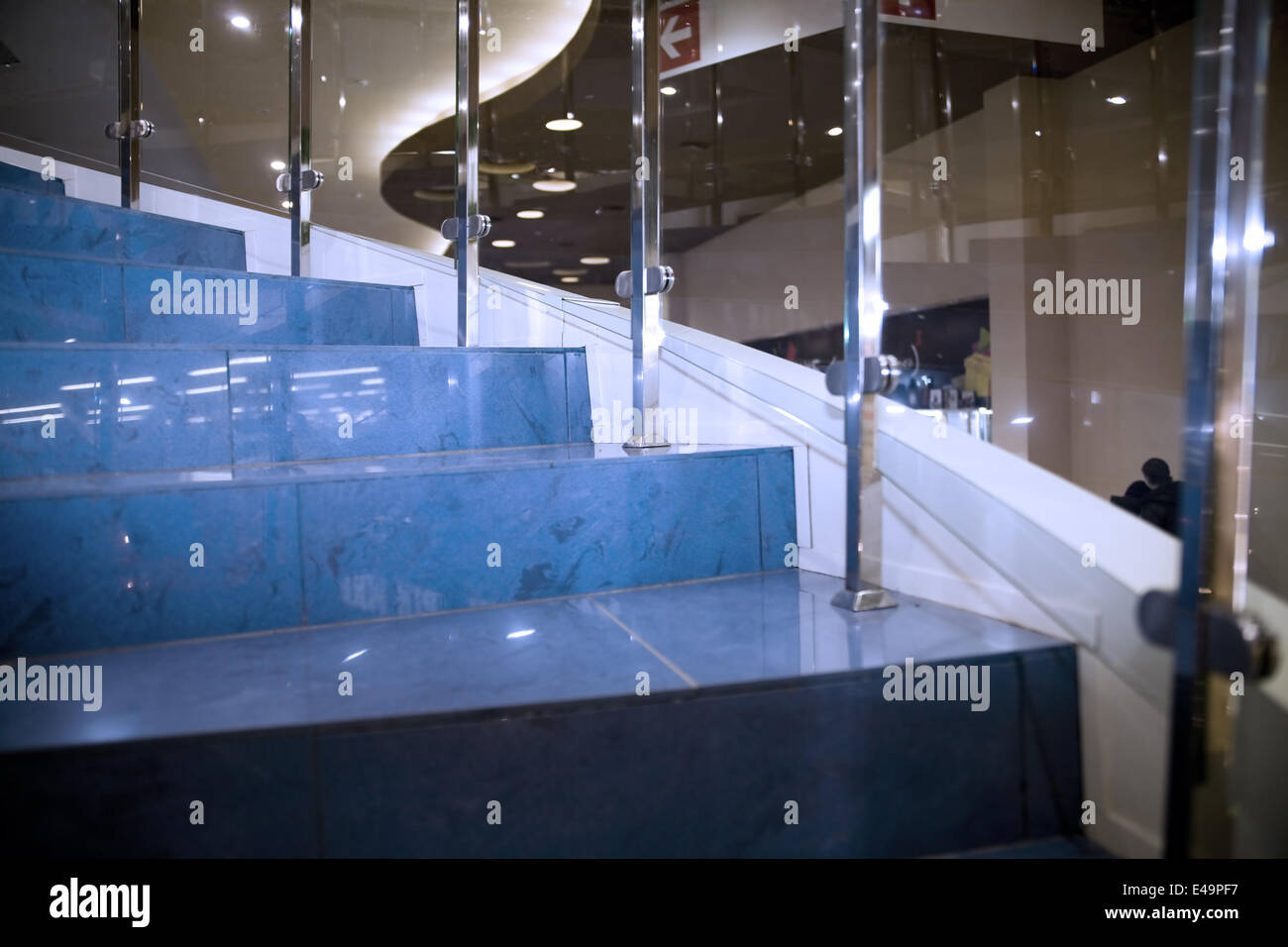 Blue marble steps in modern office building Stock Photo - Alamy
