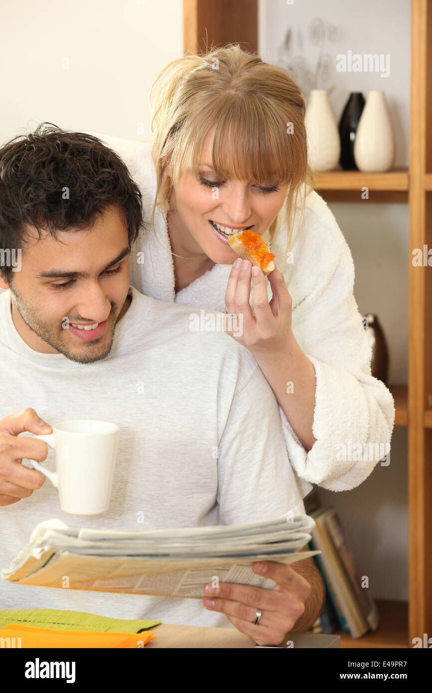 young happy couple having breakfast Stock Photo - Alamy