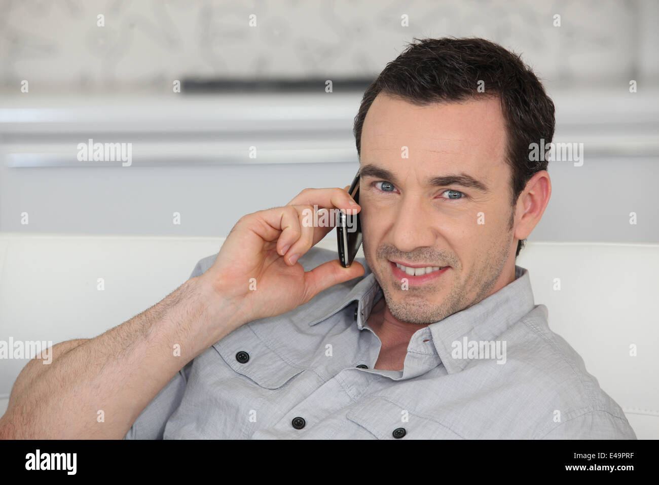Man talking on his cellphone Stock Photo - Alamy