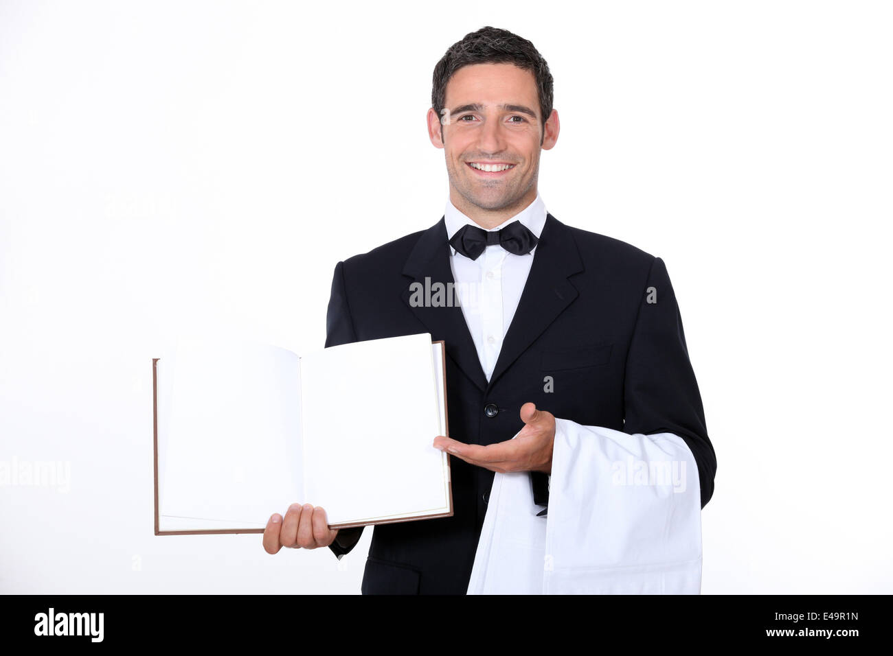 Waiter presenting menu Stock Photo - Alamy