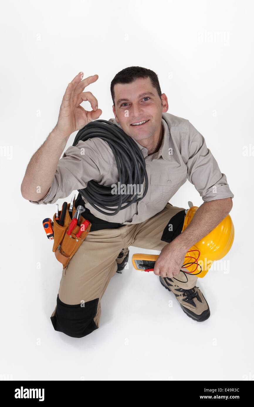 An electrician doing an ok sign Stock Photo - Alamy