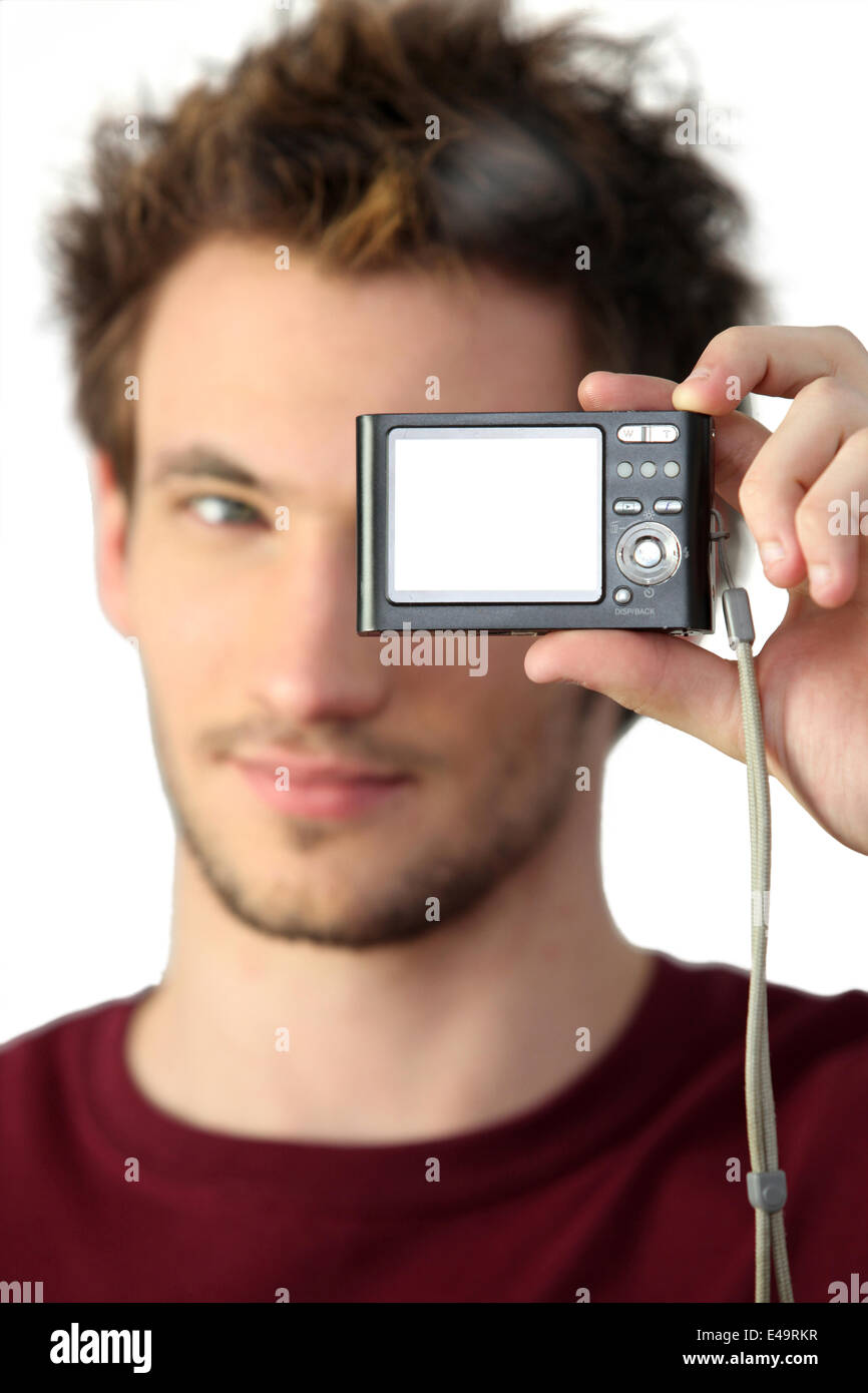 young man holding digital camera Stock Photo - Alamy