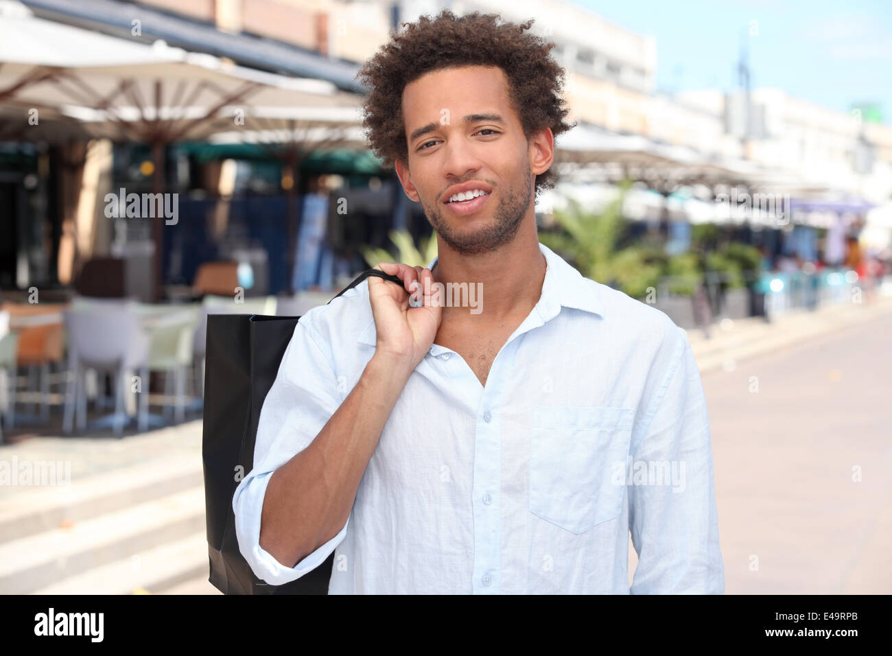 Man out shopping Stock Photo - Alamy