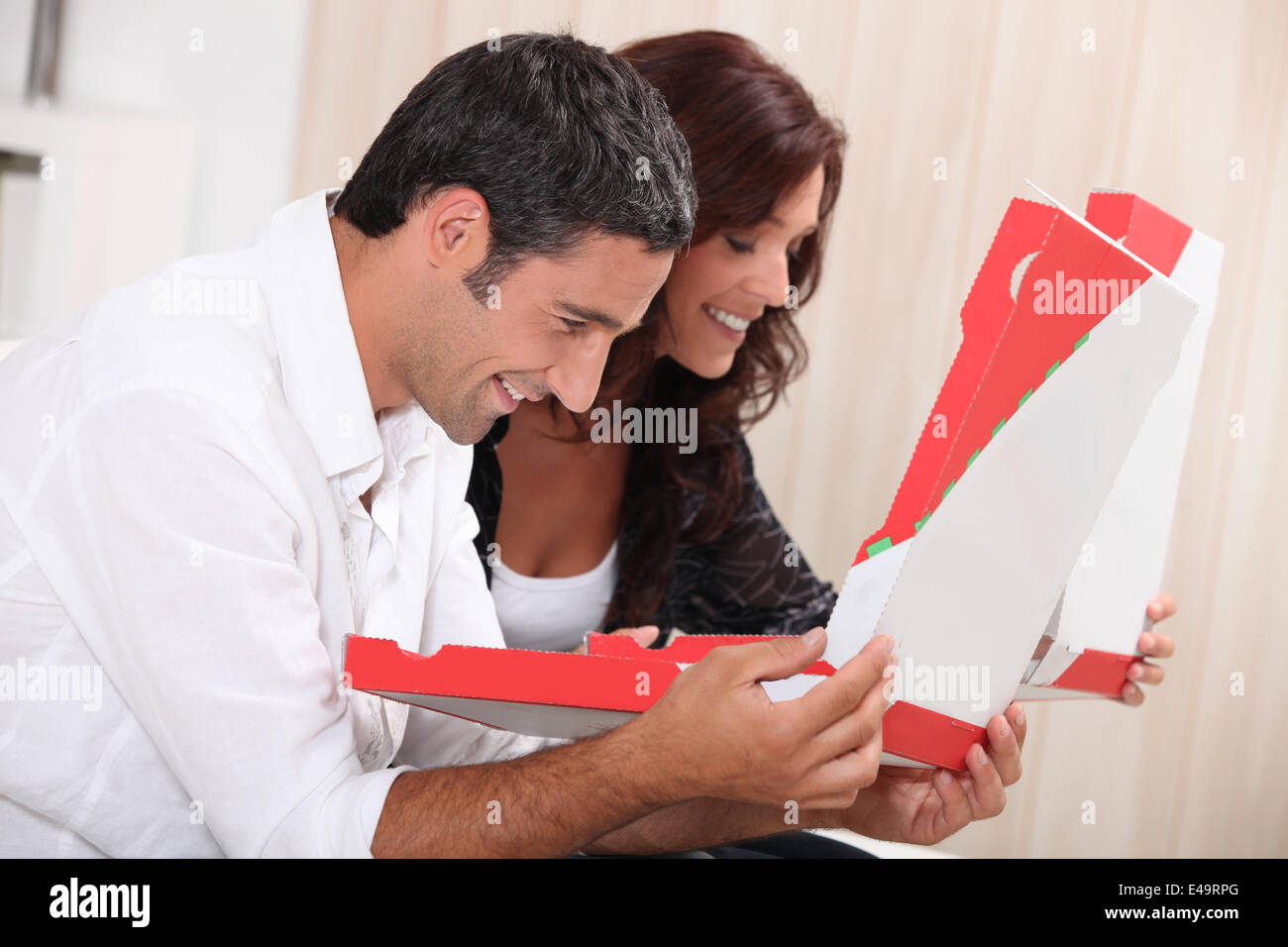 Couple with take-out pizza boxes Stock Photo - Alamy