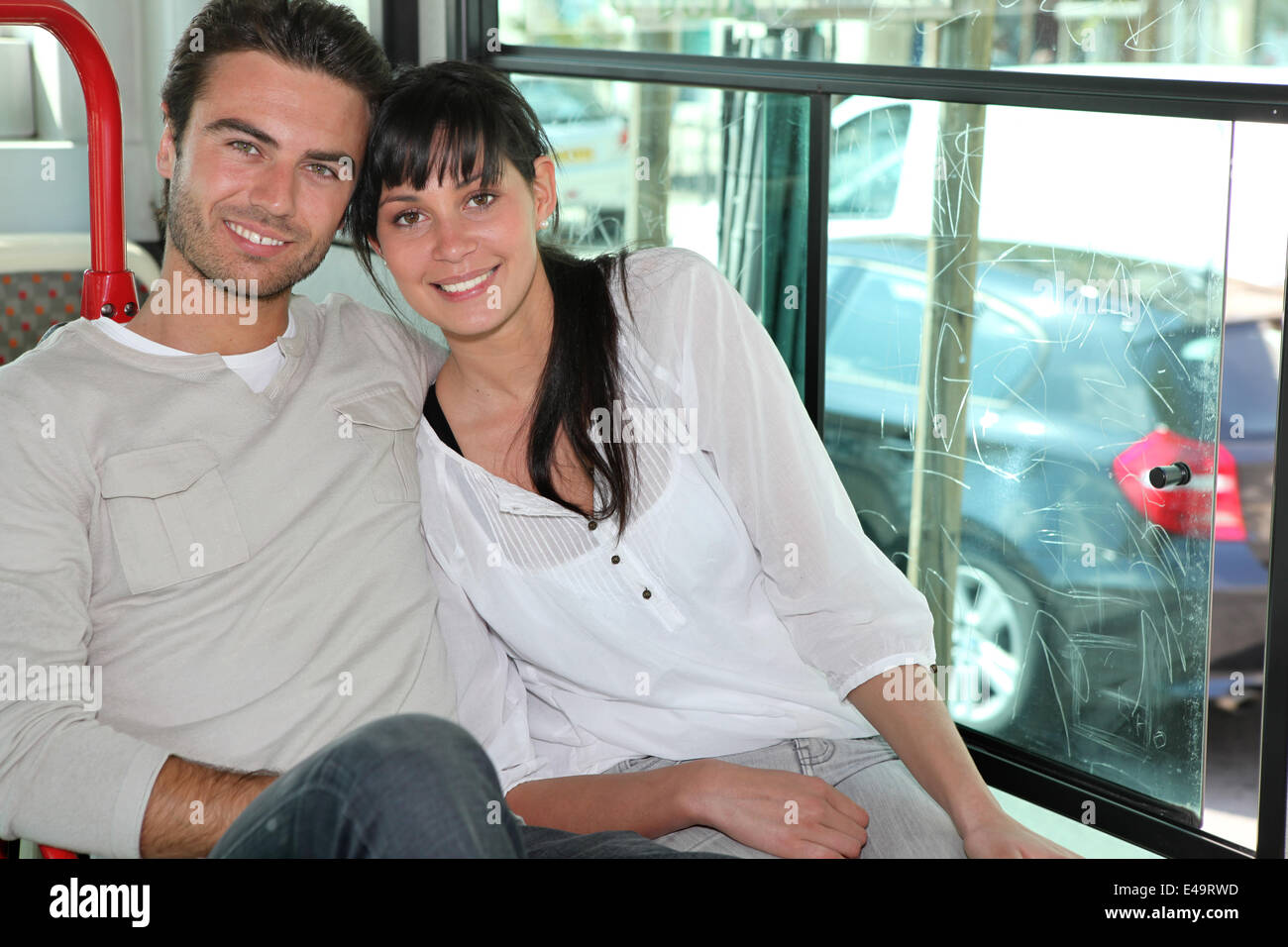Young people sitting in a bus Stock Photo - Alamy