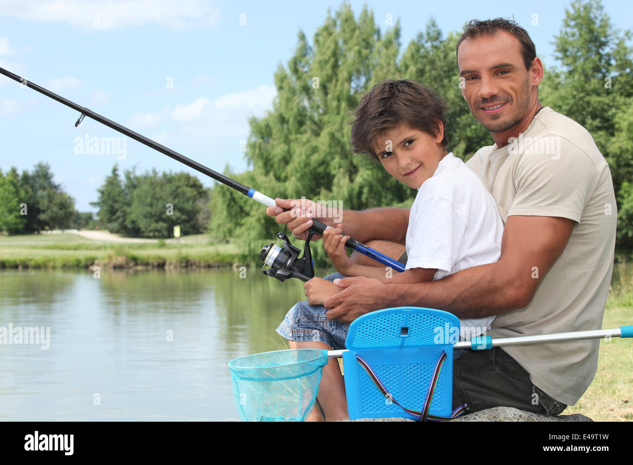 Father and son fishing Stock Photo - Alamy