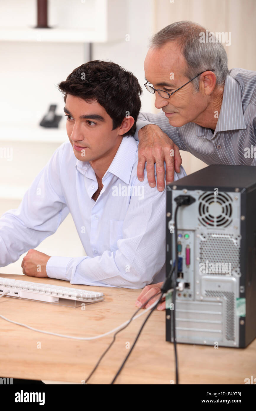 Father and son on the computer Stock Photo - Alamy