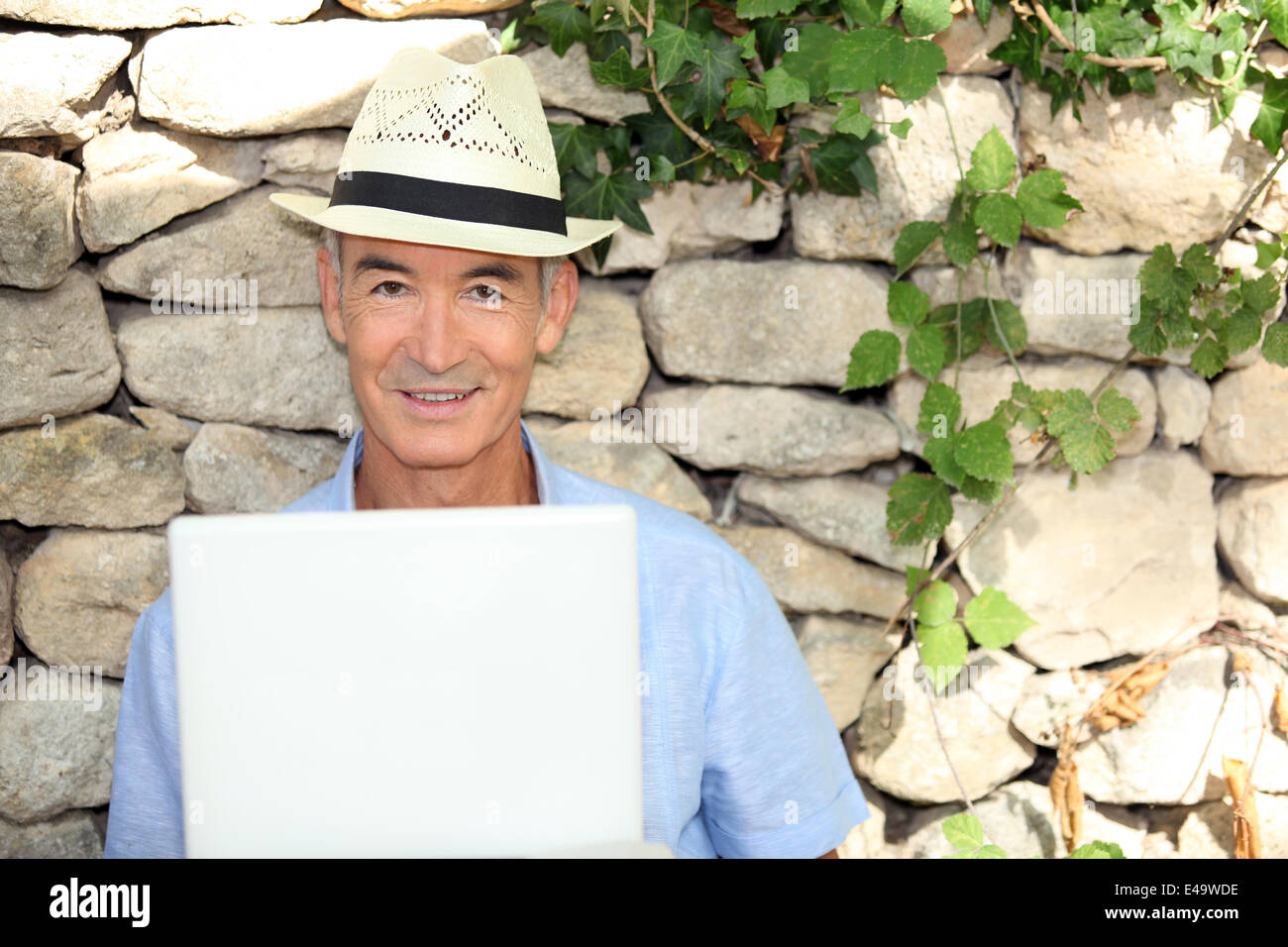 Man sitting outside church hi-res stock photography and images - Alamy