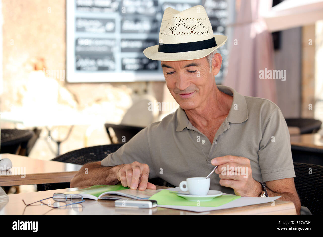 senior gentleman enjoying free time in cafe Stock Photo - Alamy