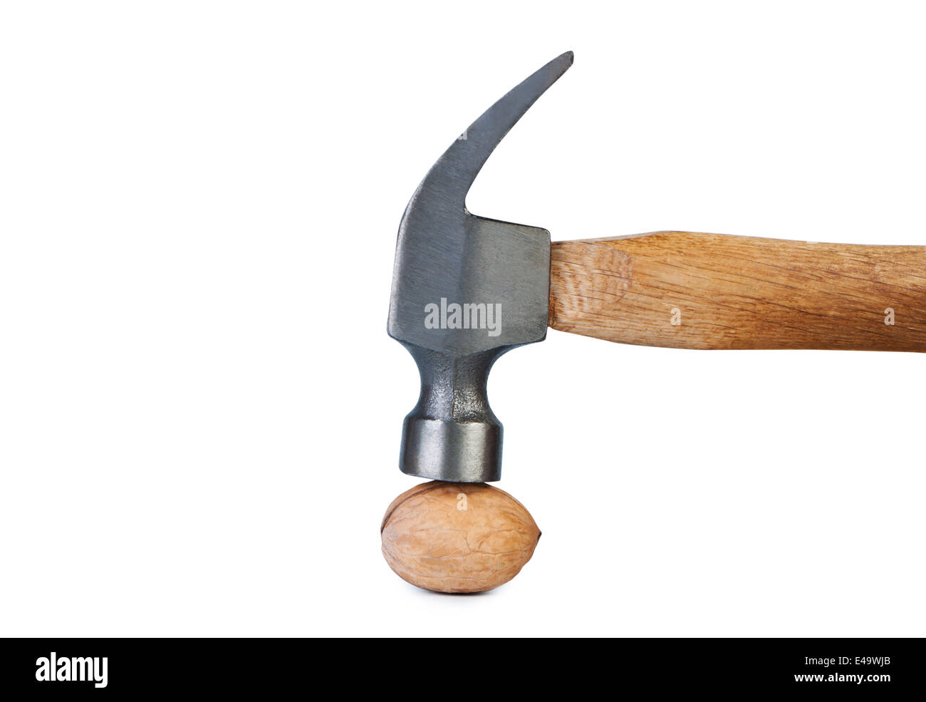 Hammer hits the nut Stock Photo - Alamy