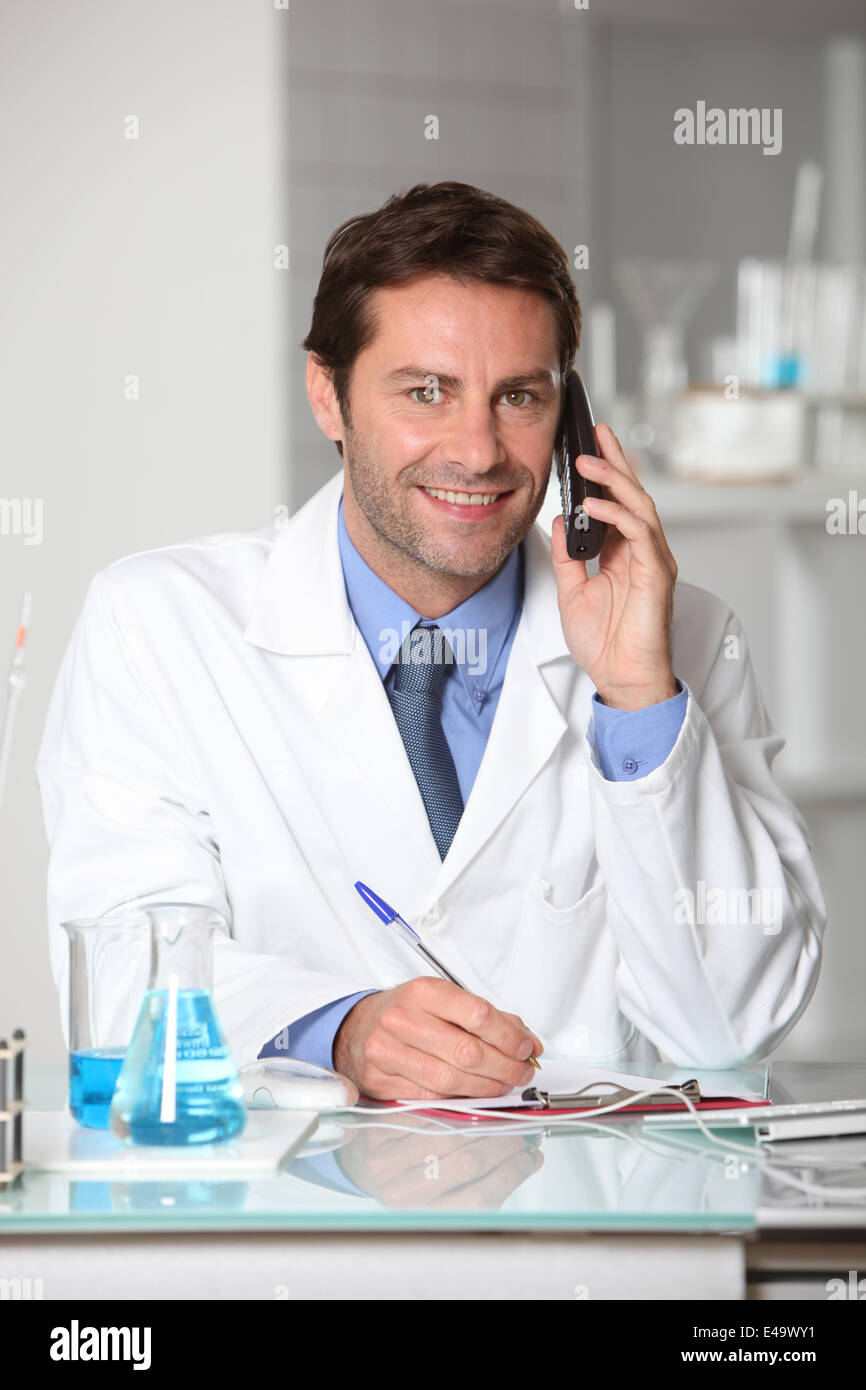 Lab technician on telephone hi-res stock photography and images - Alamy