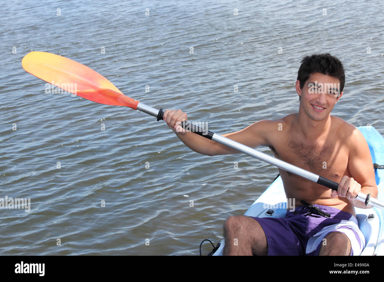 young man on a kayak Stock Photo - Alamy