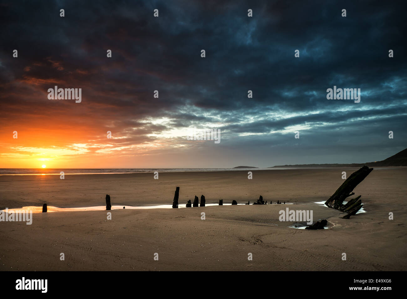 Dramatic sunset landscape over shipwreck on Rhosilli Bay beach Stock ...