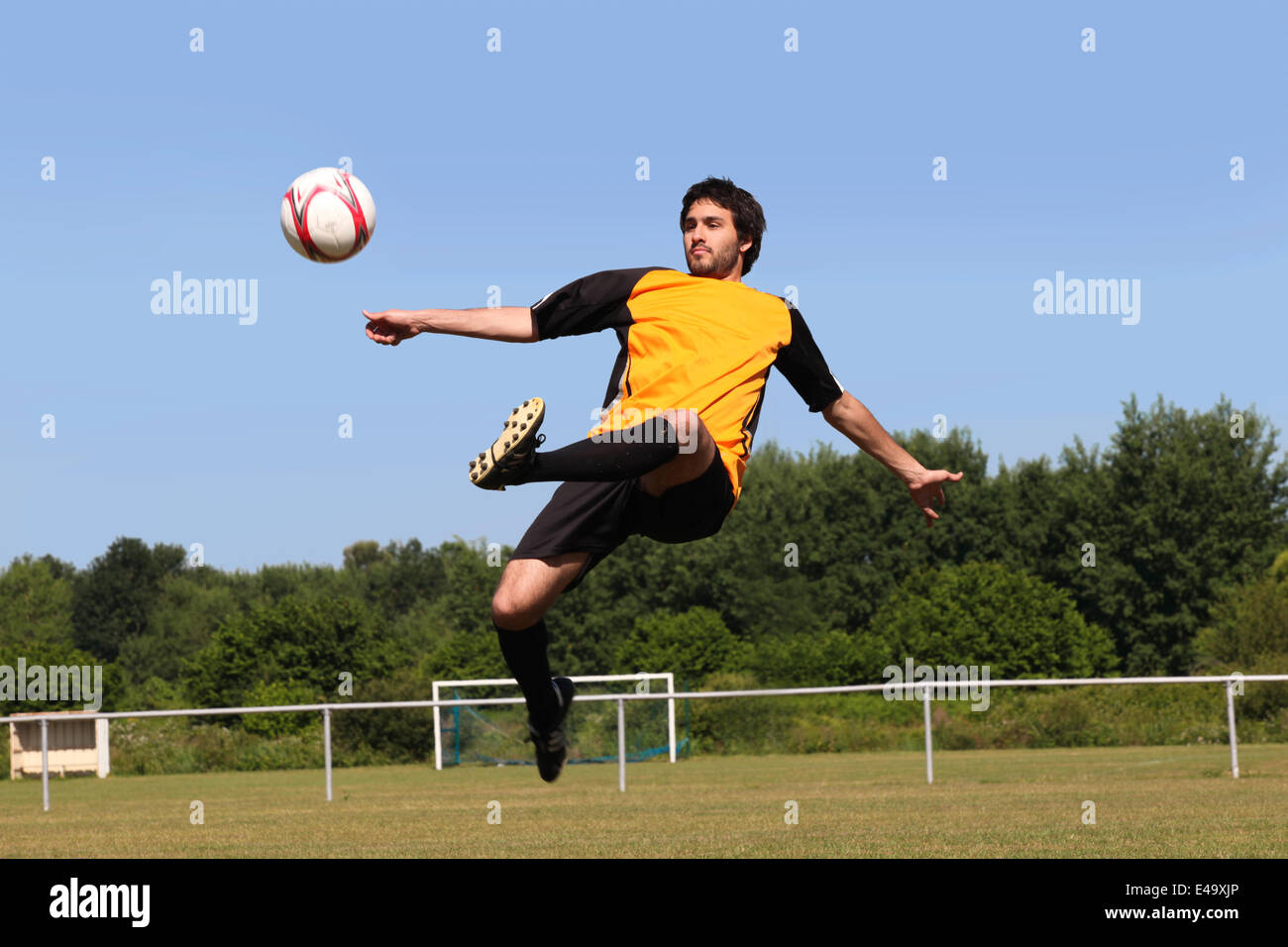 Football mid air action hi-res stock photography and images - Alamy