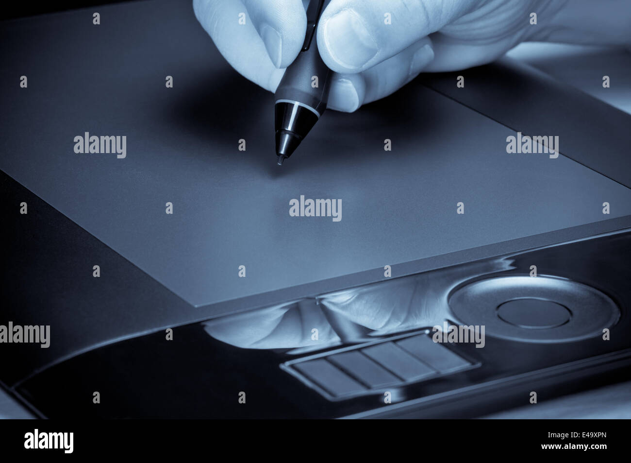 Hand drawing with pen on graphics tablet Stock Photo - Alamy